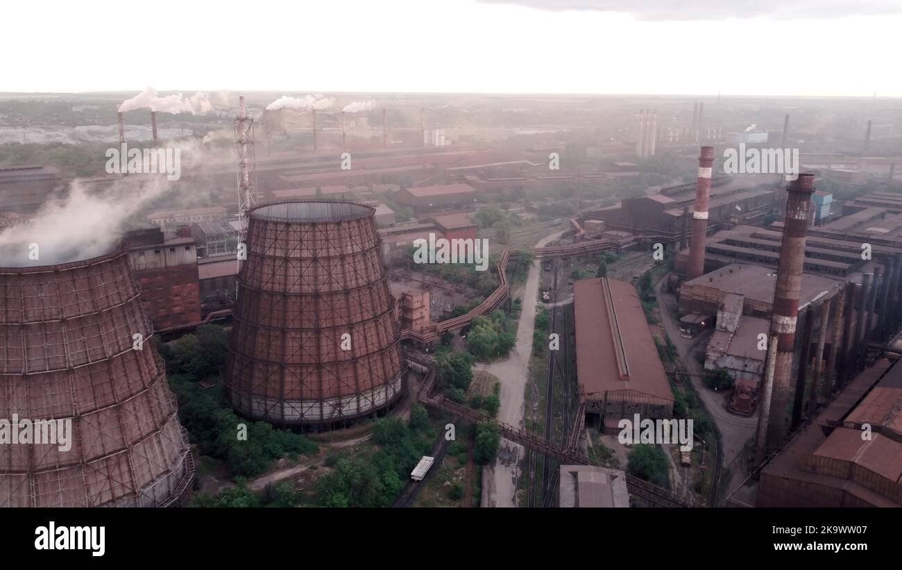 Metallurgical factory with chimneys and smog. Industrial plant for ...