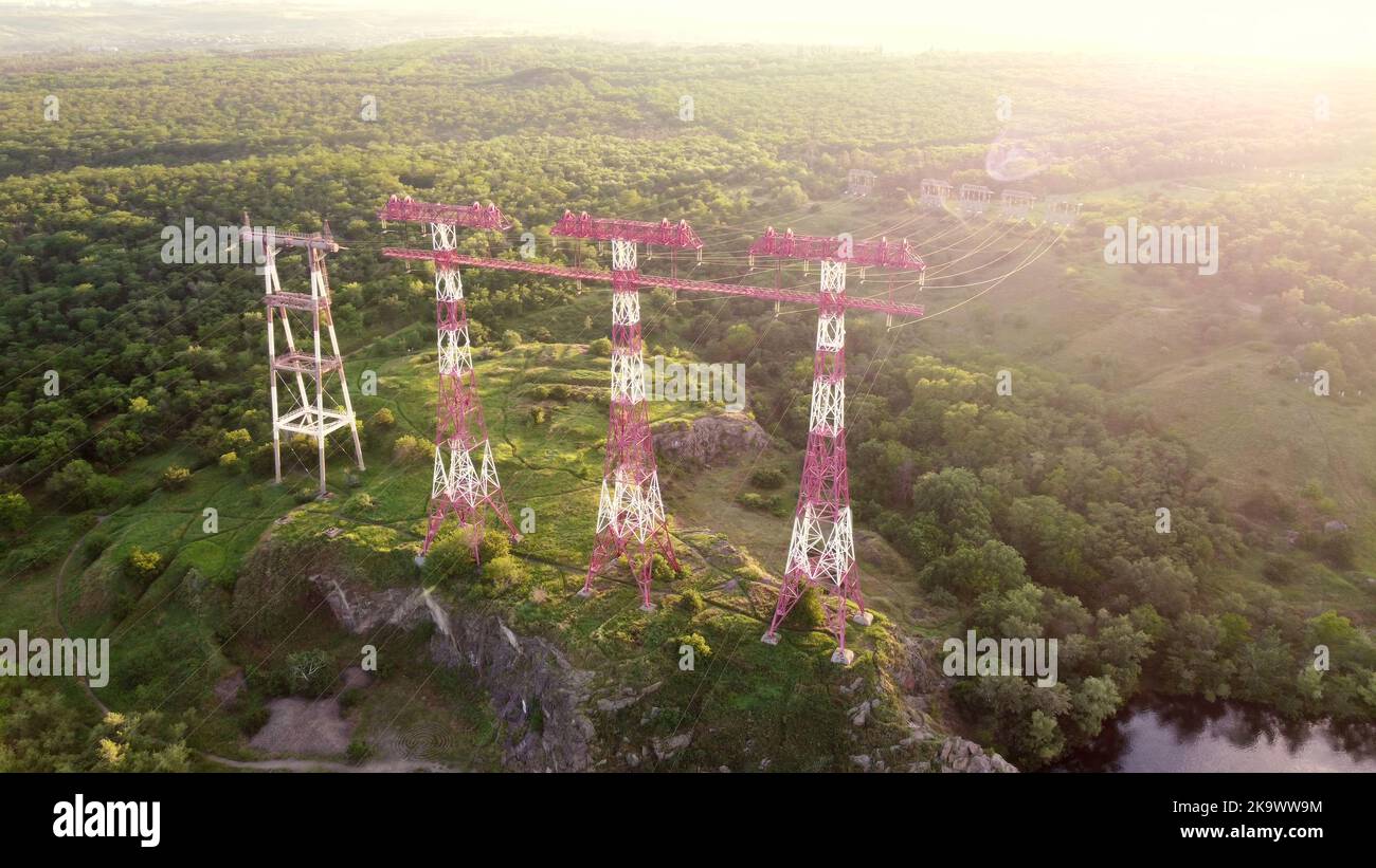High voltage post.High-voltage tower sun beam. High voltage power lines ...