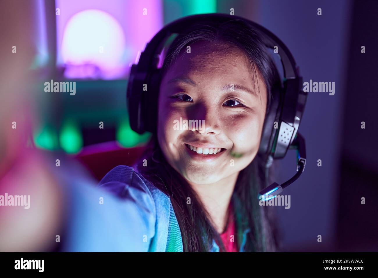 Young chinese woman streamer smiling confident make selfie by camera at ...