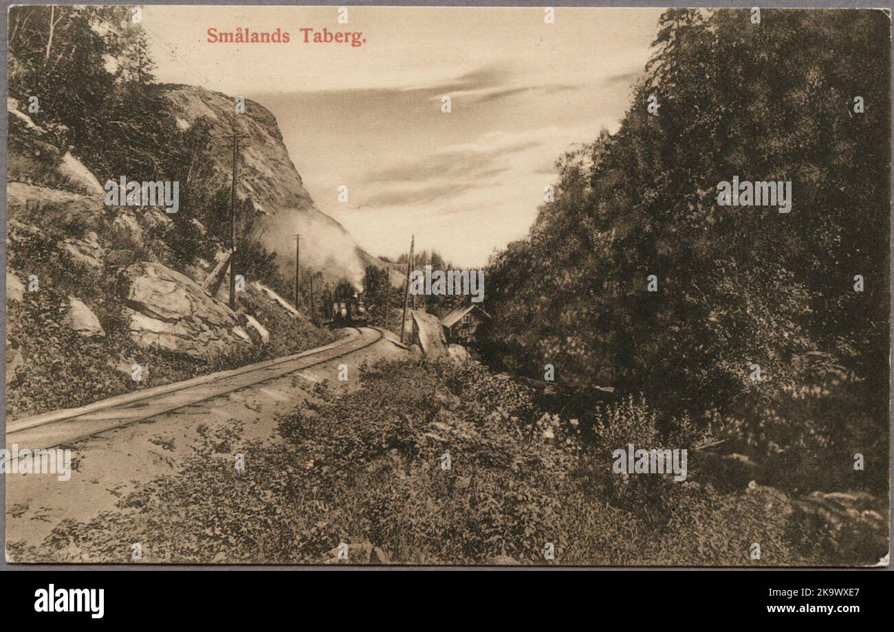 Railway line and train on mountain slope Stock Photo - Alamy