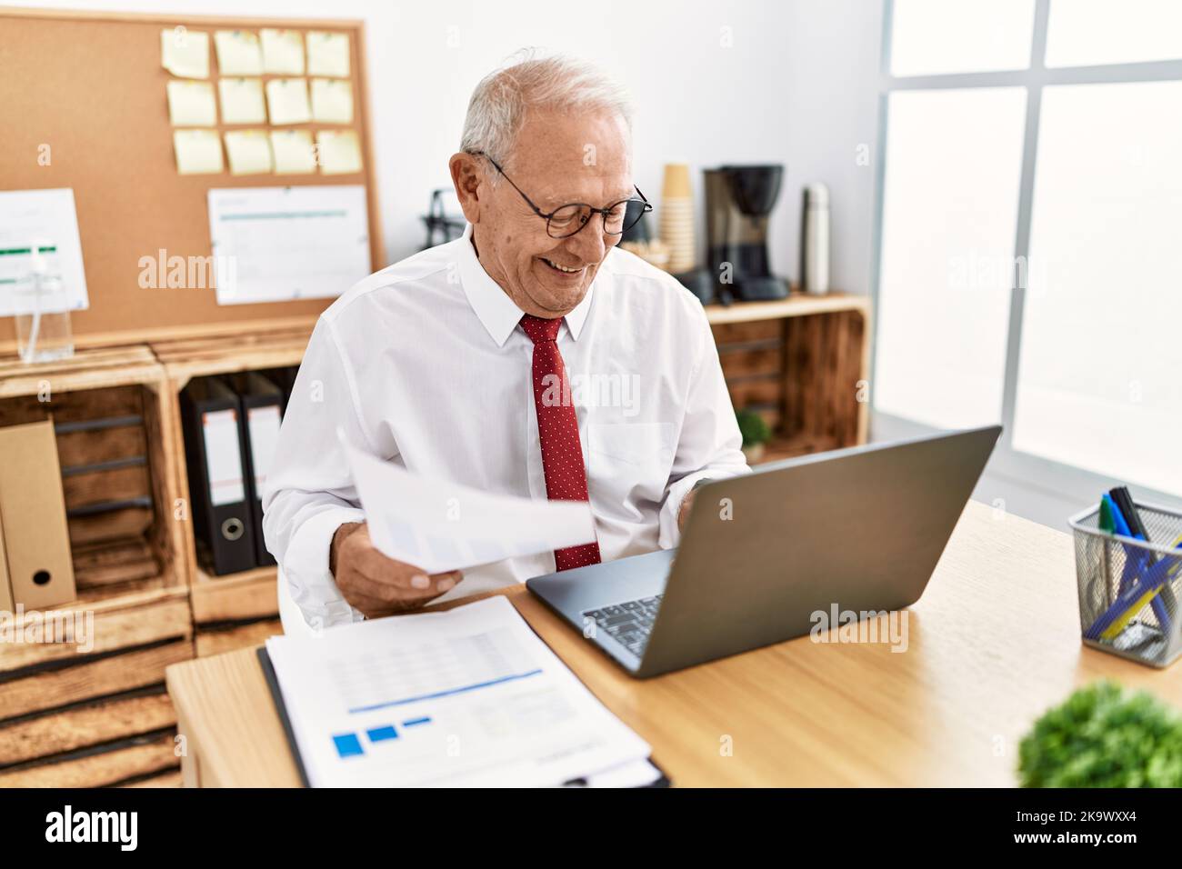 Senior man business worker reading document working at office Stock ...