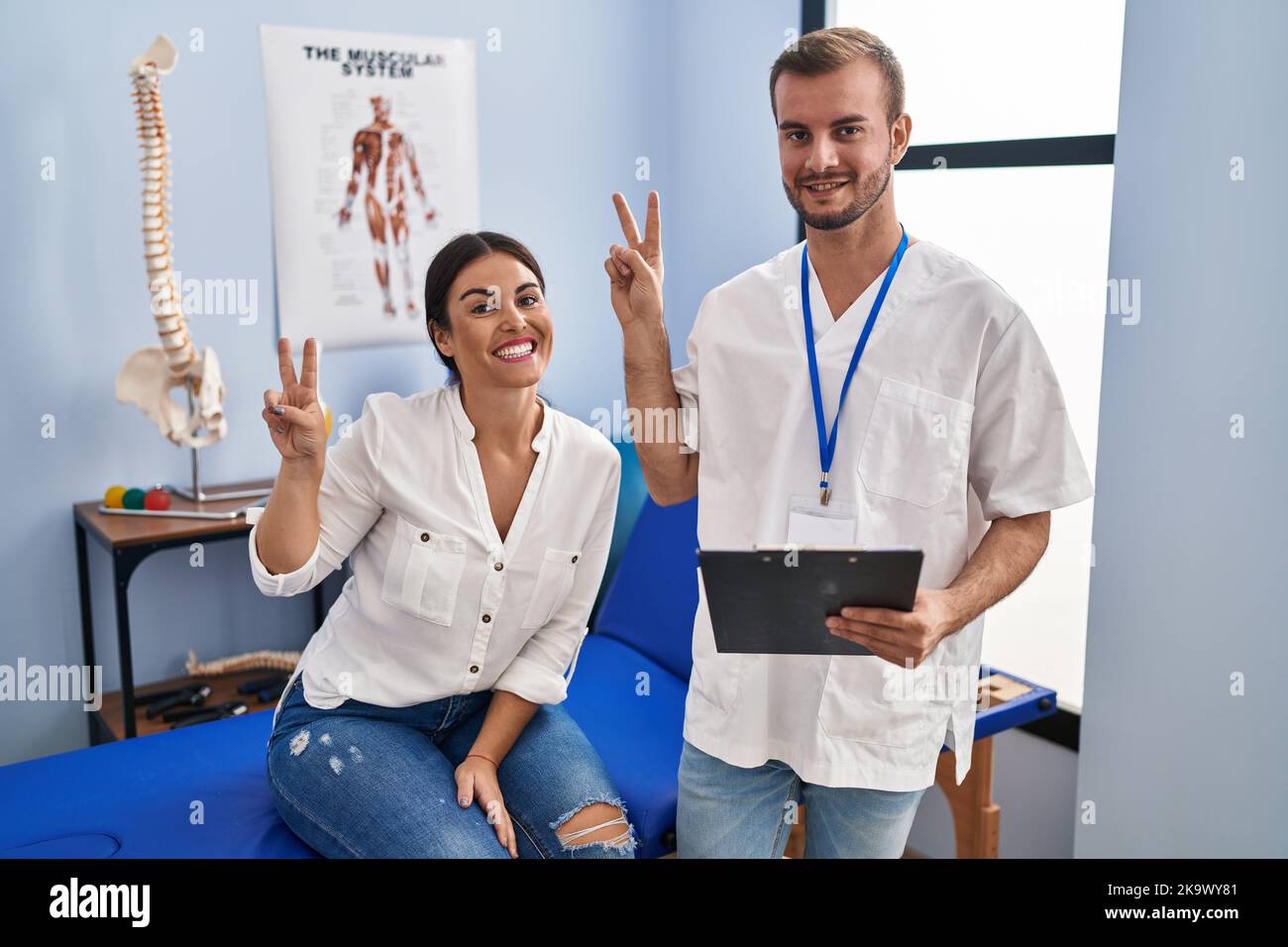 Young hispanic woman at physiotherapist appointment smiling with happy ...