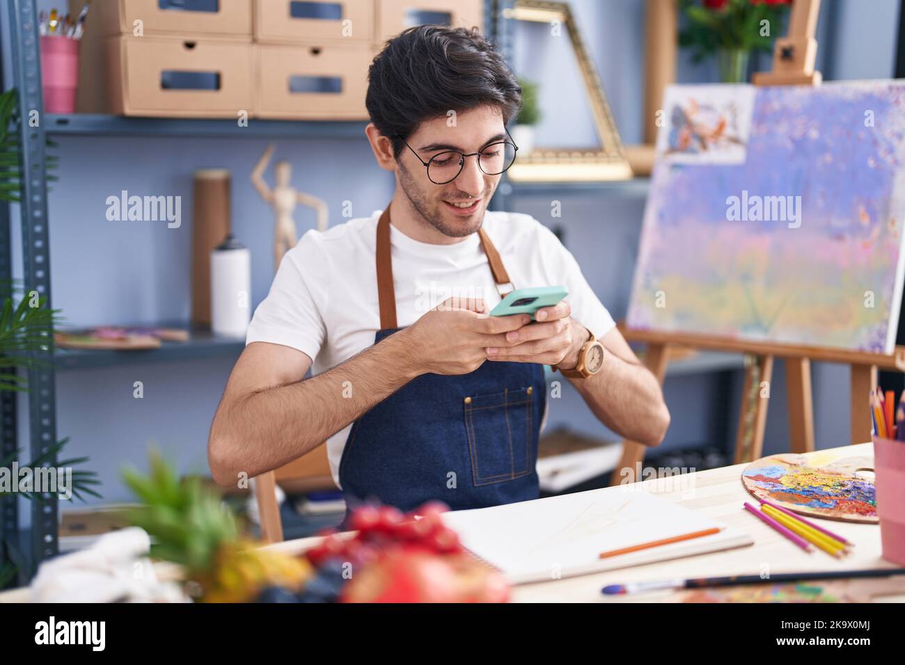Young hispanic man artist smiling confident make photo to draw at art ...