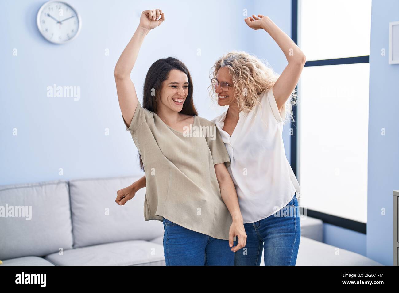 Two women mother and daughter dancing at home Stock Photo - Alamy