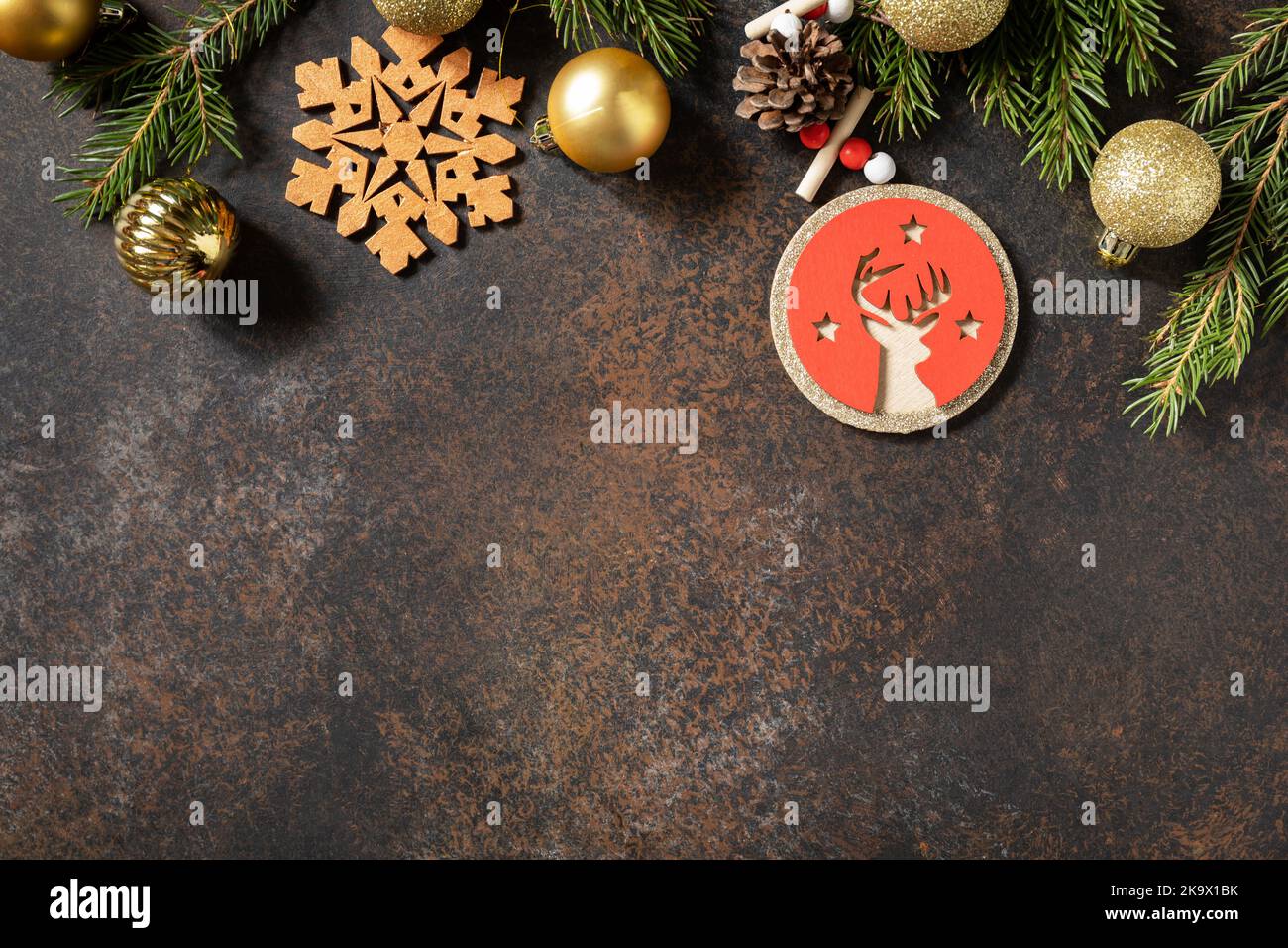 Christmas brown stone background with Christmas tree and red balls ...