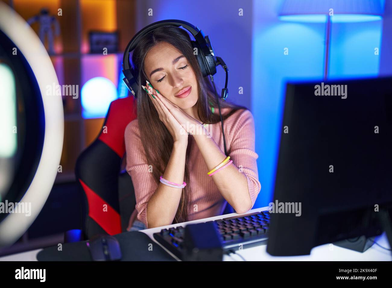 Tired female gamer playing video games hi-res stock photography and ...