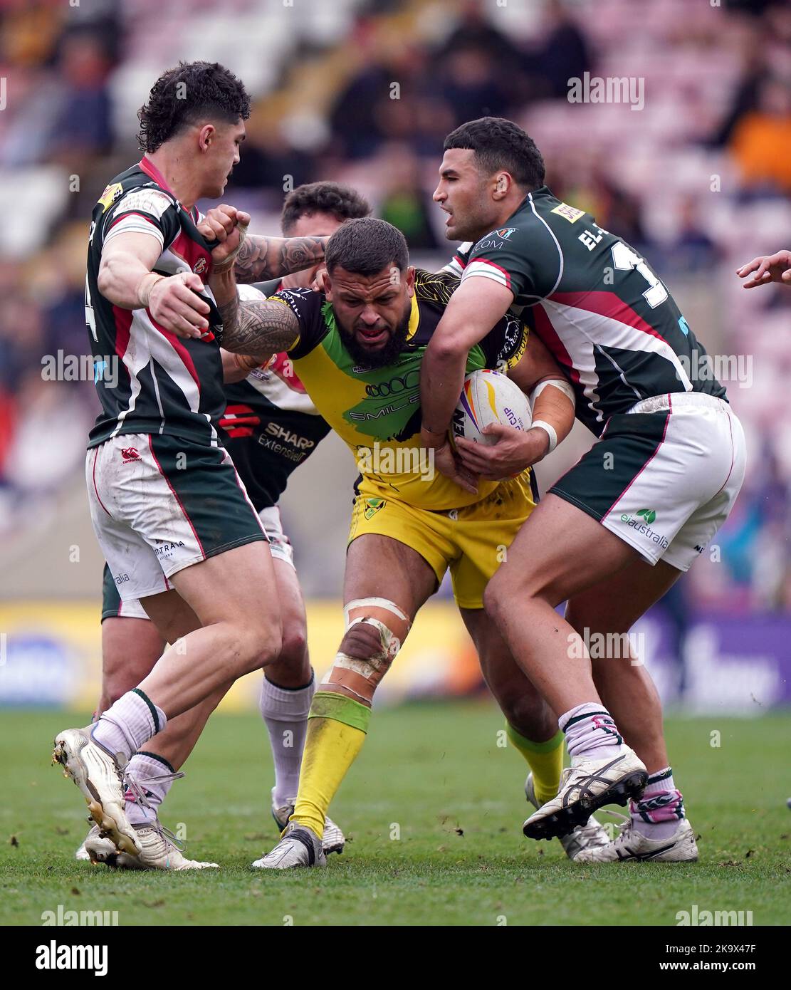 Lebanon’s Brad Morkos and Elie El-Zakham (right) tackle Jamaica’s ...