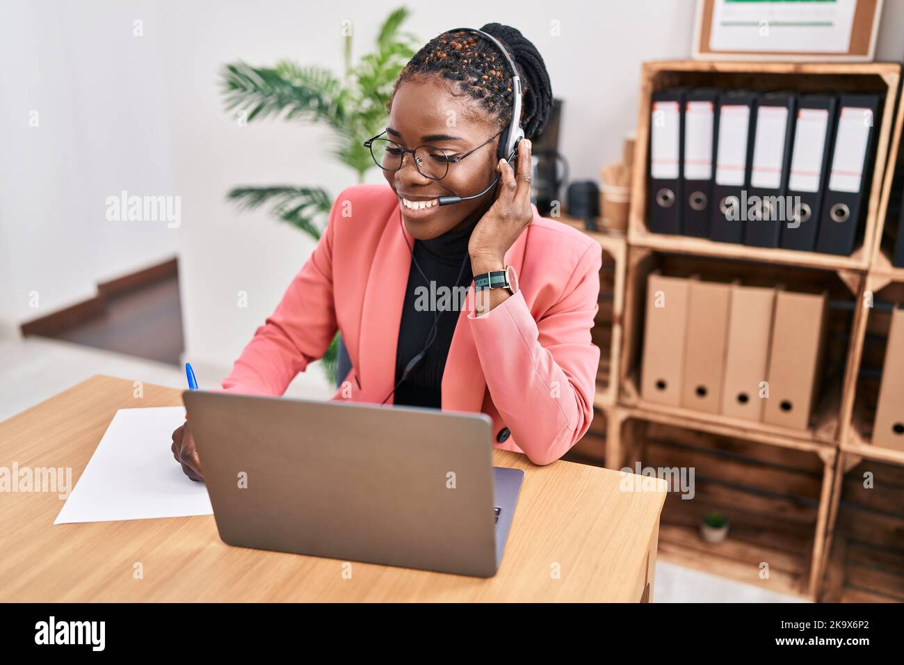 African american woman call center agent working at office Stock Photo ...