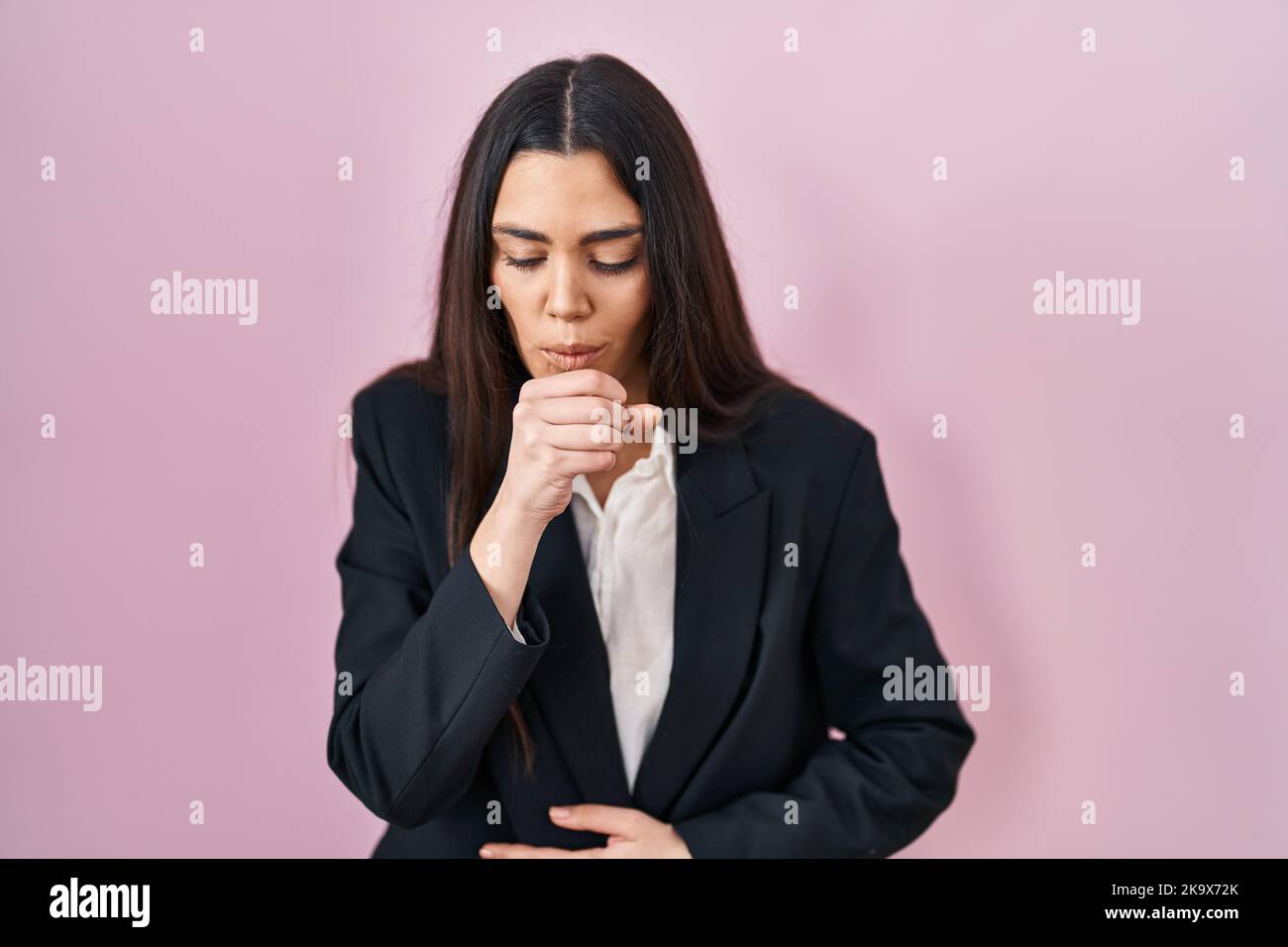 Young brunette woman wearing business style over pink background ...