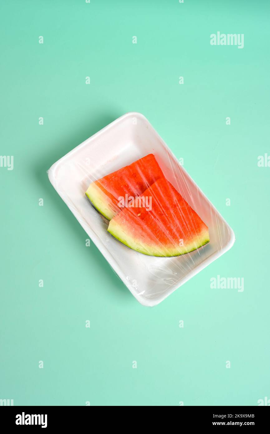 fresh watermelon slices wrapped in plastic wrap, vertical picture Stock ...