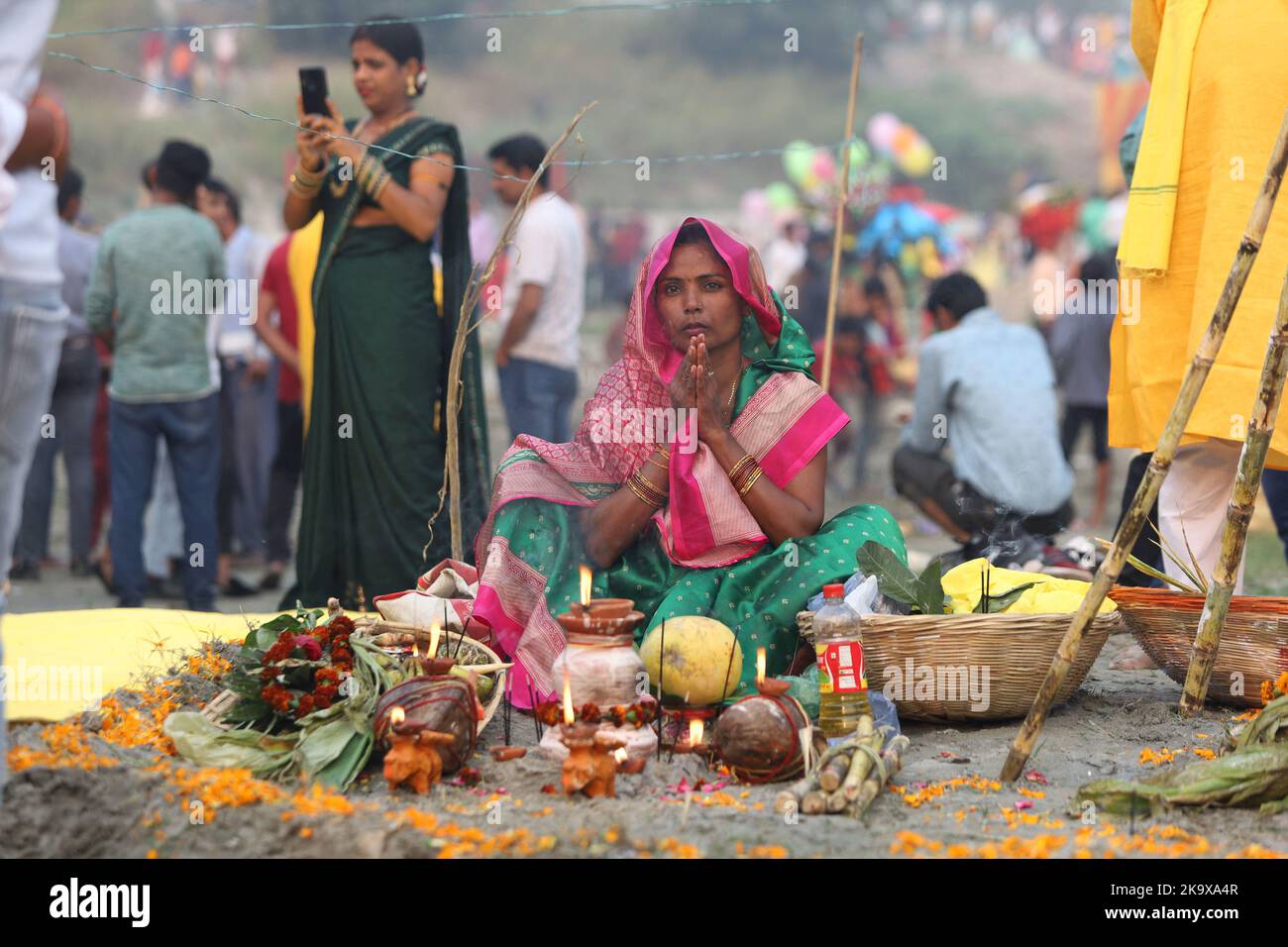 Devotees offering evening prayers during Chhat Puja at river Yamnua ...