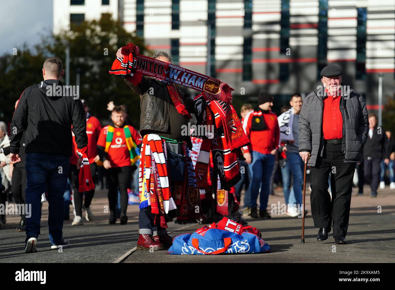 A vendor sells scarves outside the stadium ahead of the Premier League ...
