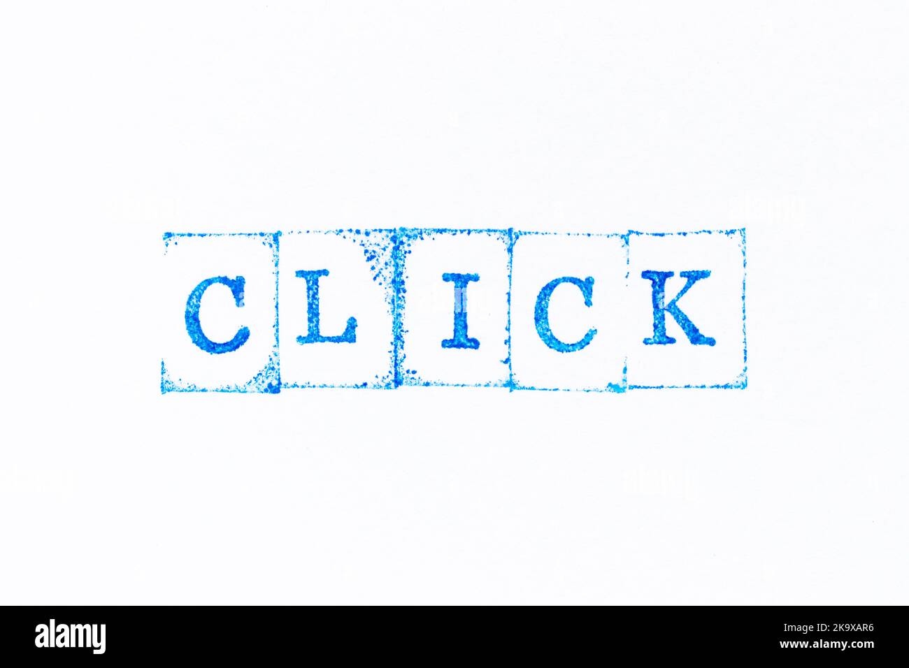 Blue color ink rubber stamp in word click on white paper background ...