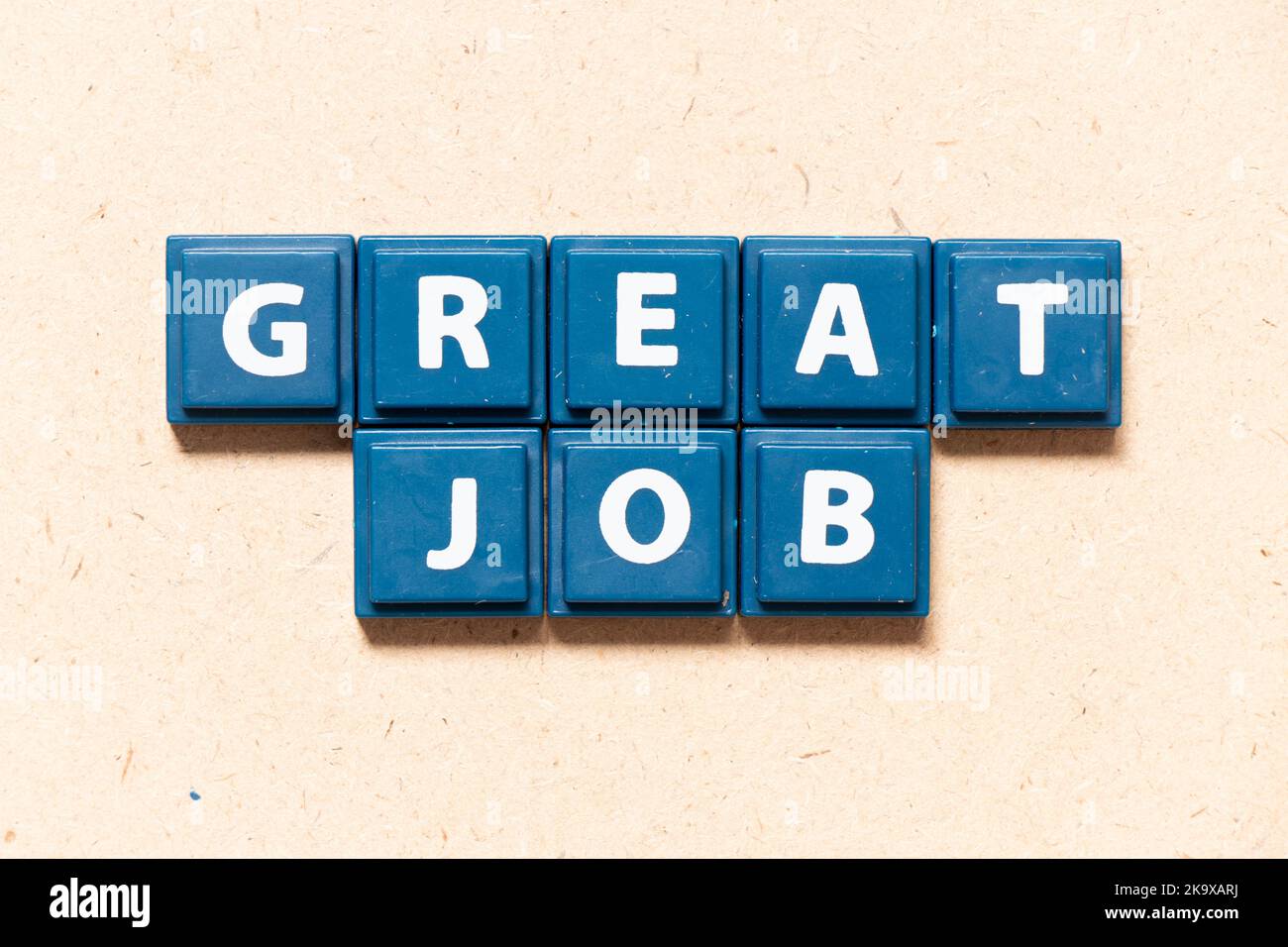 Tile letter in english word great job on wood background Stock Photo ...