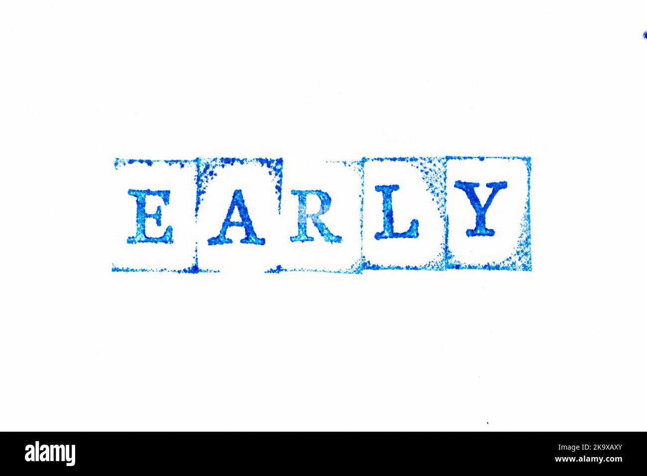Blue color ink rubber stamp in word early on white paper background ...