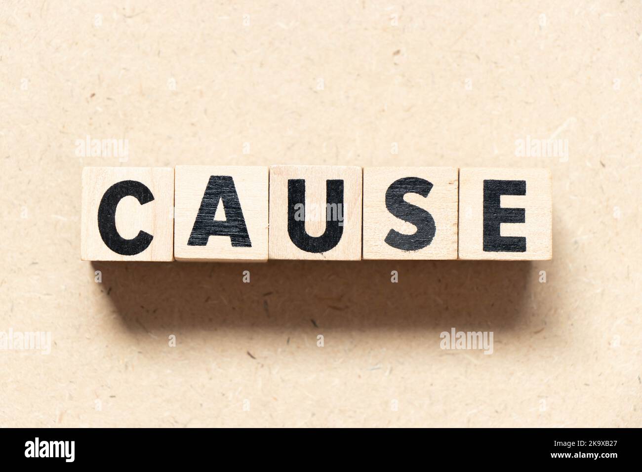 Alphabet letter block in word cause on wood background Stock Photo - Alamy
