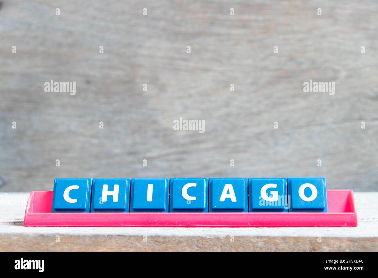 Tile alphabet letter with word chicago in red color rack on wood ...