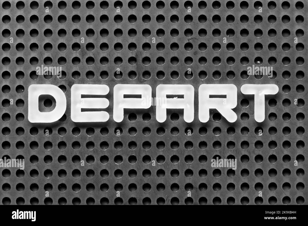 White alphabet letter in word depart on black pegboard background Stock ...