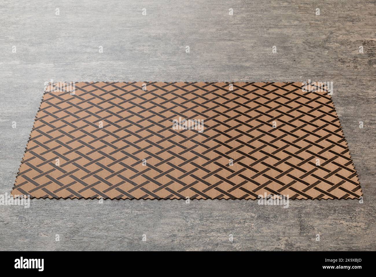 Perspective view of brown tablecloth for food on cement background ...