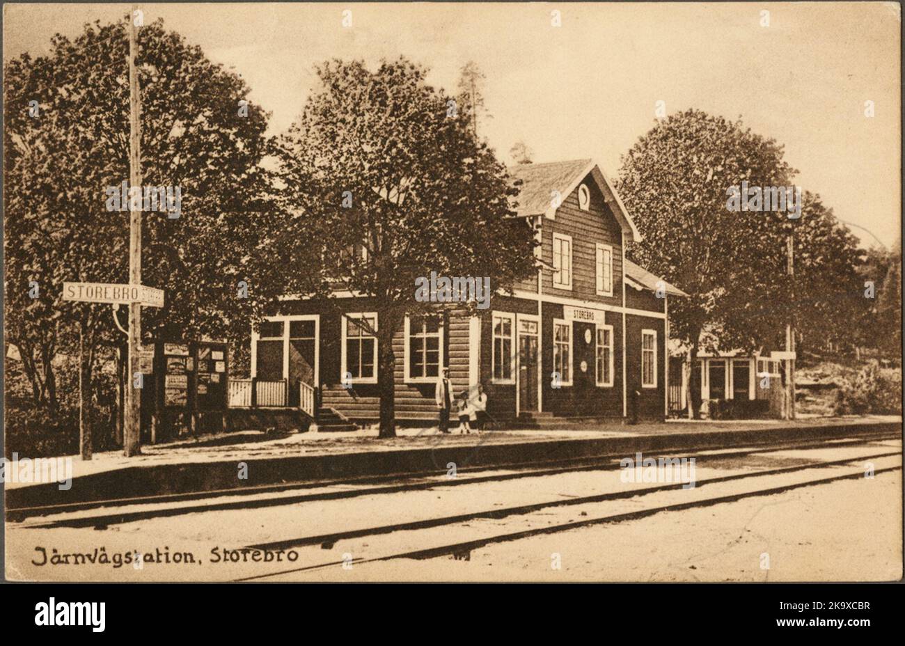 Track side of station with view at station house Stock Photo - Alamy