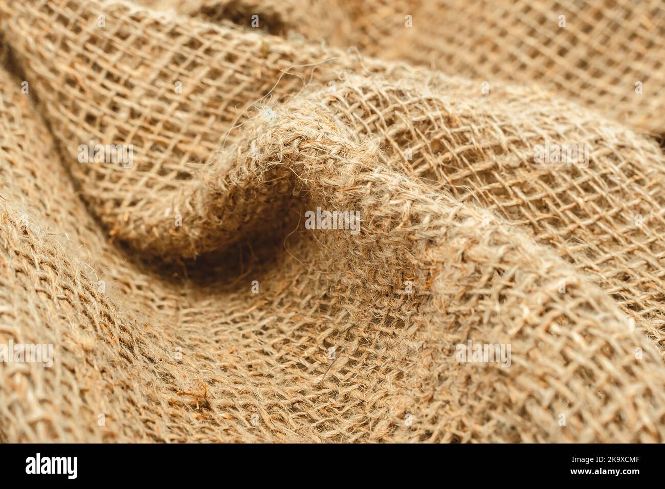 Burlap texture. Burlap fabric background with waves, folds and bruises ...