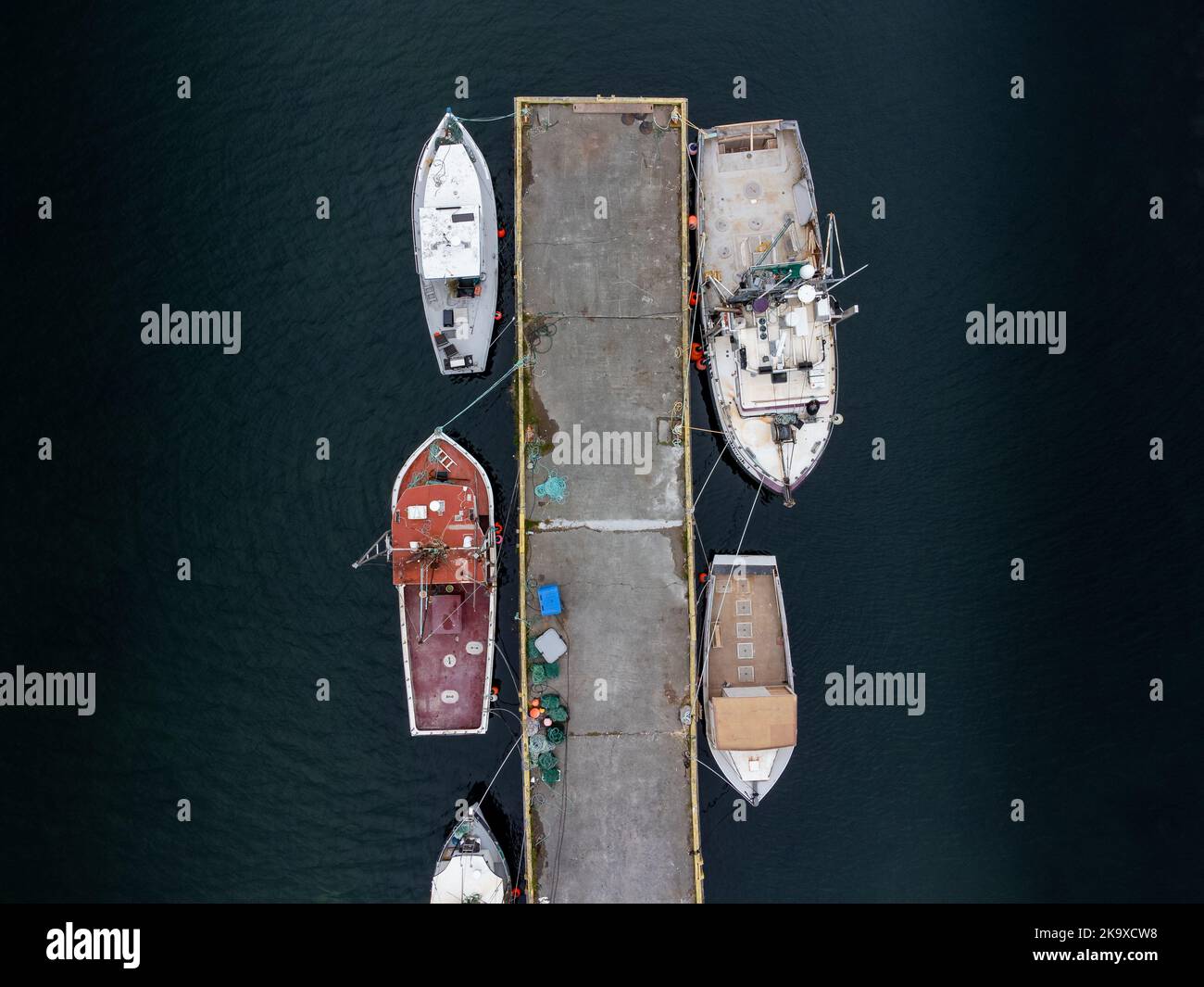 Looking down view of fishing boats tied to a dock on the East coast of ...
