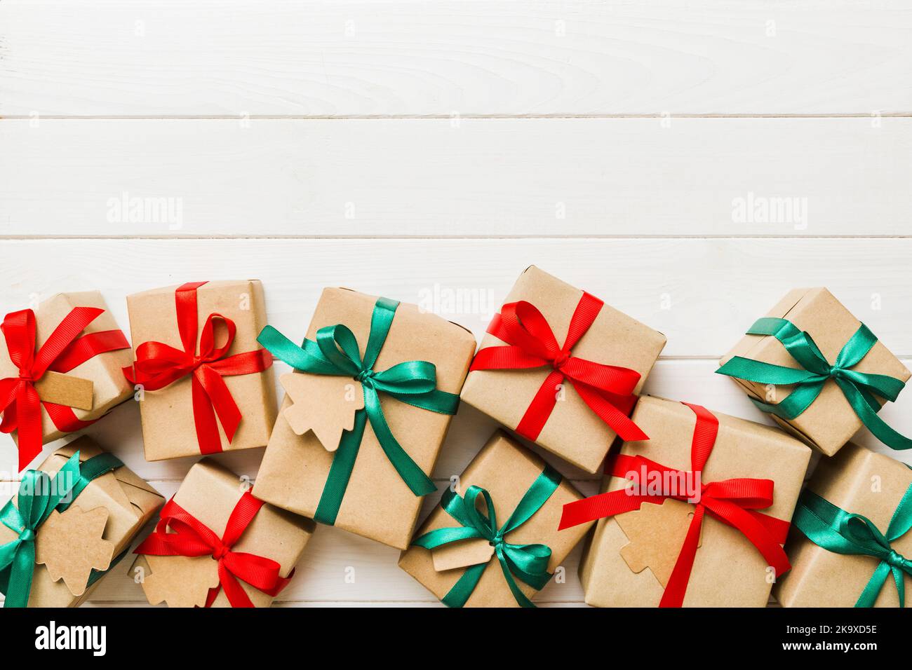 Colored craft gift boxes with colorful ribbons on colored background ...