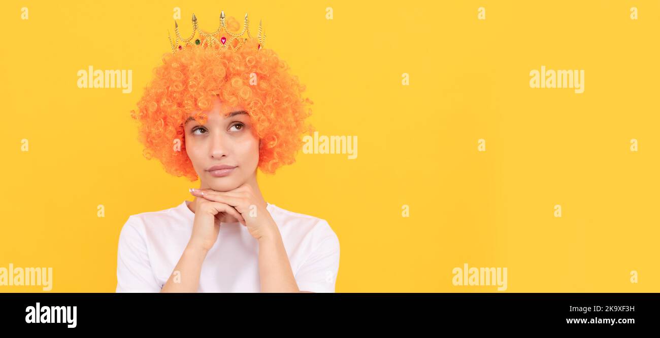 egoistic funny girl with fancy look wearing orange hair wig and ...