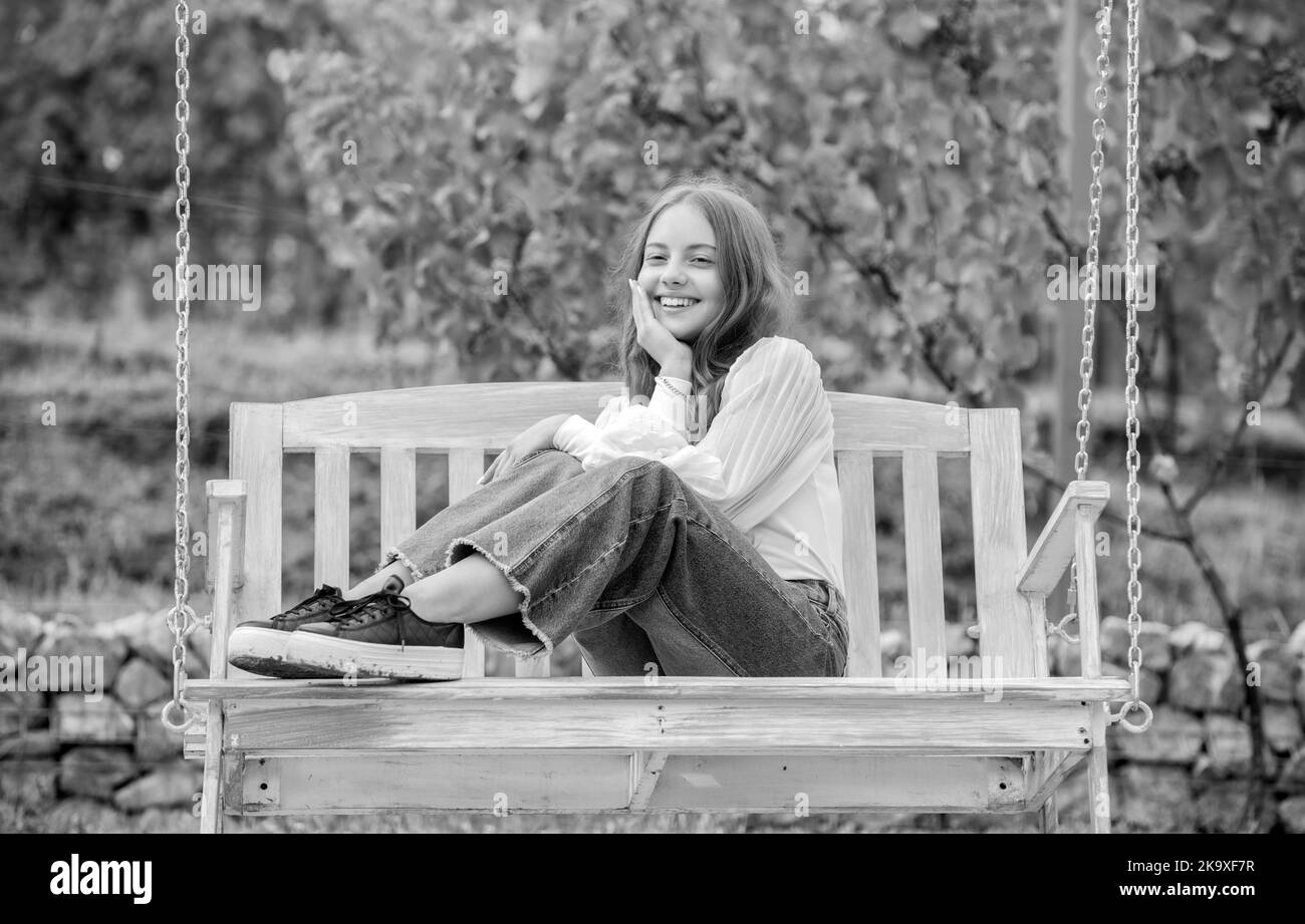 positive emotions. smiling child on swing. kid swinging outdoor. teen ...