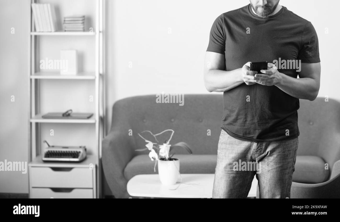 cropped adult man typing text message in smartphone, communication ...