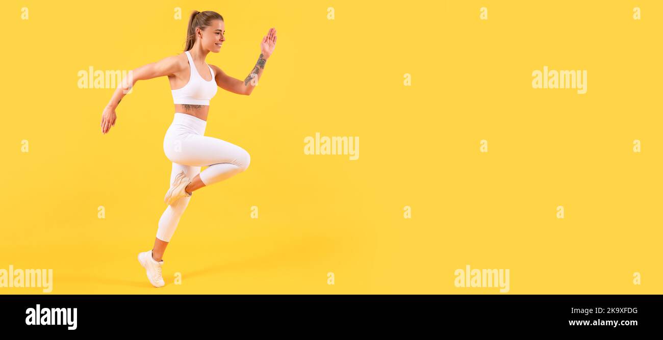 fitness girl runner running on yellow background. Woman jumping running ...