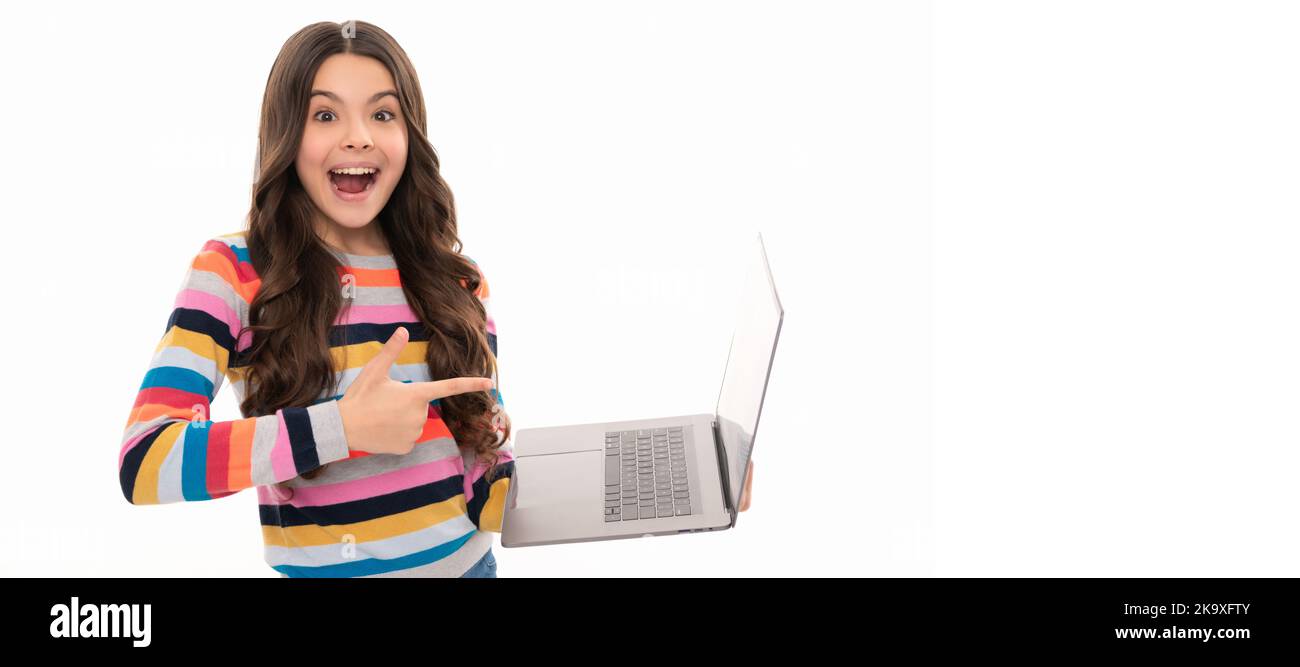 surprised teen girl study online education pointing finger on computer ...