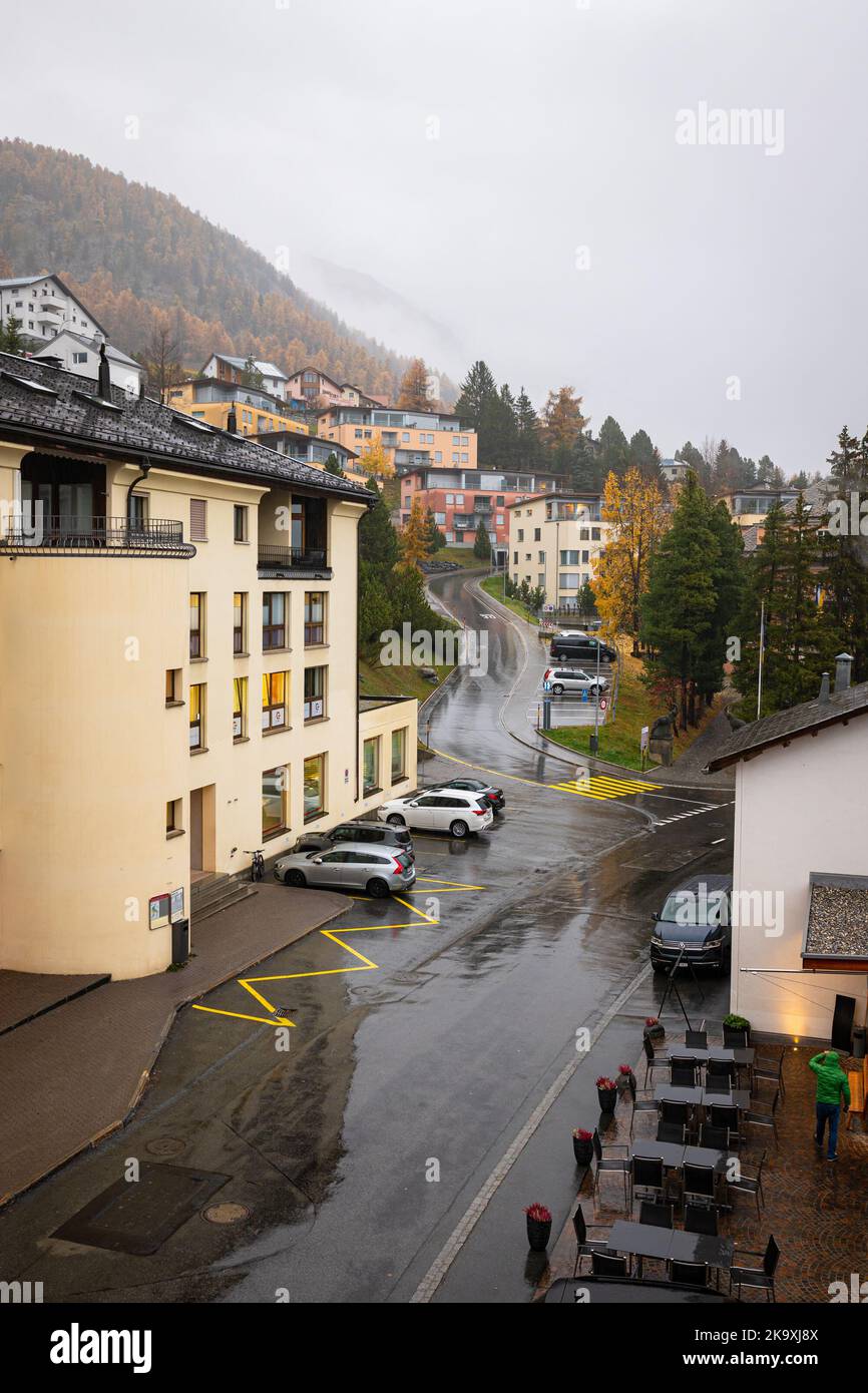 Uphill street in the town of Samedan, Switzerland after a rain shower ...