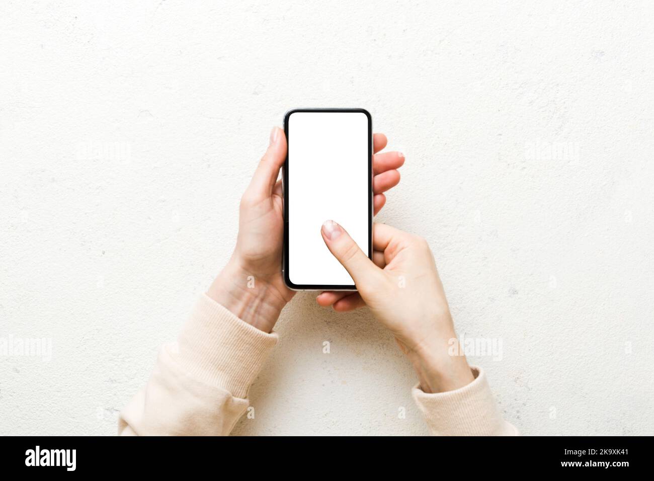Top view of woman hands holding smart phone with blank copy space ...
