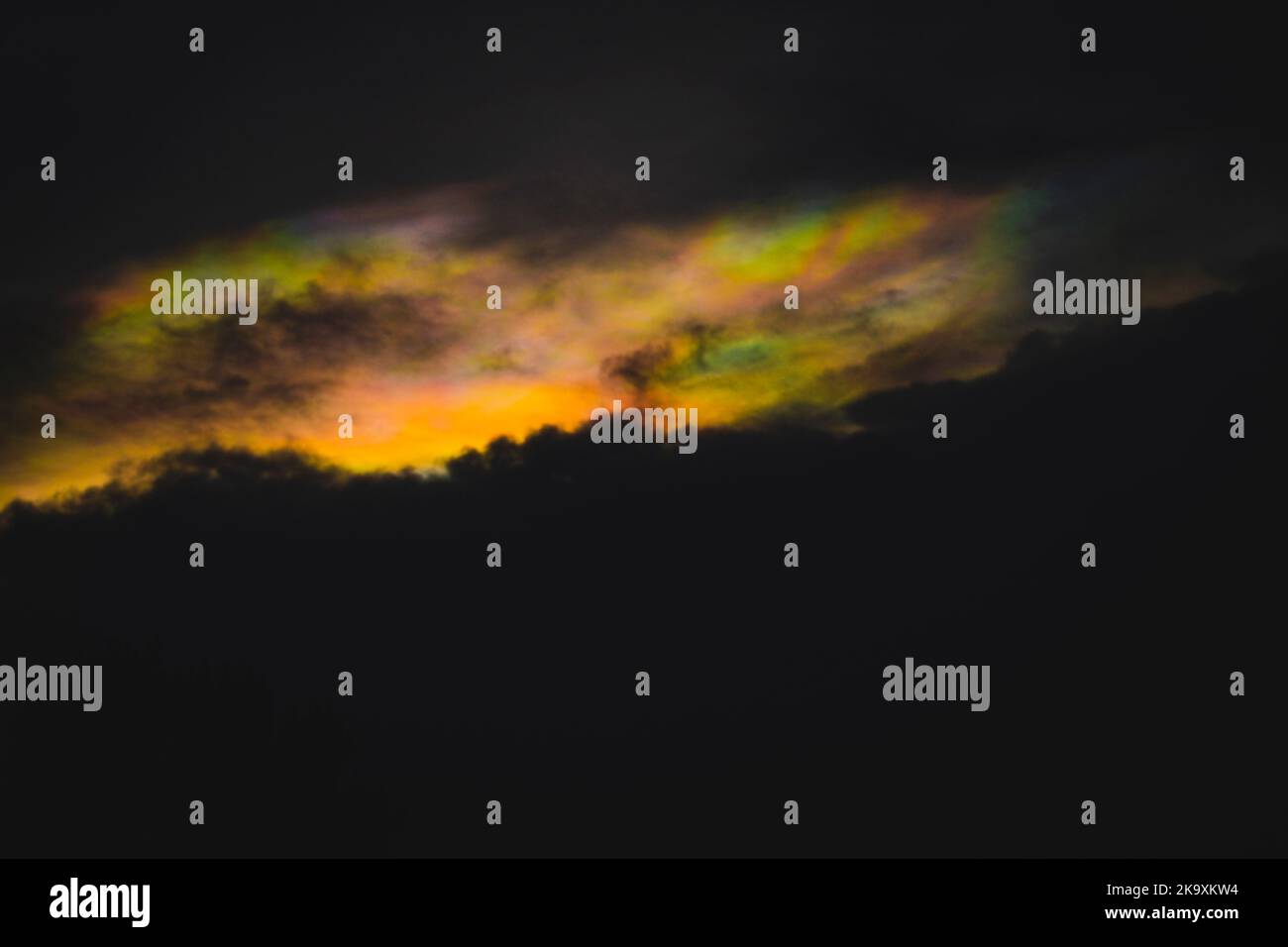 A rainbow cloud called cloud iridescence nature background Stock Photo ...