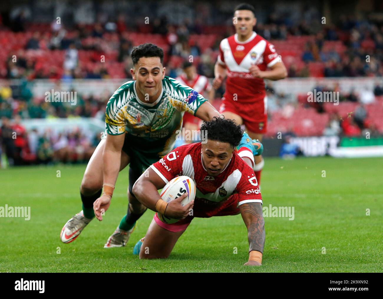Tonga's Tesi Niu goes over the line to score a try during the Rugby ...