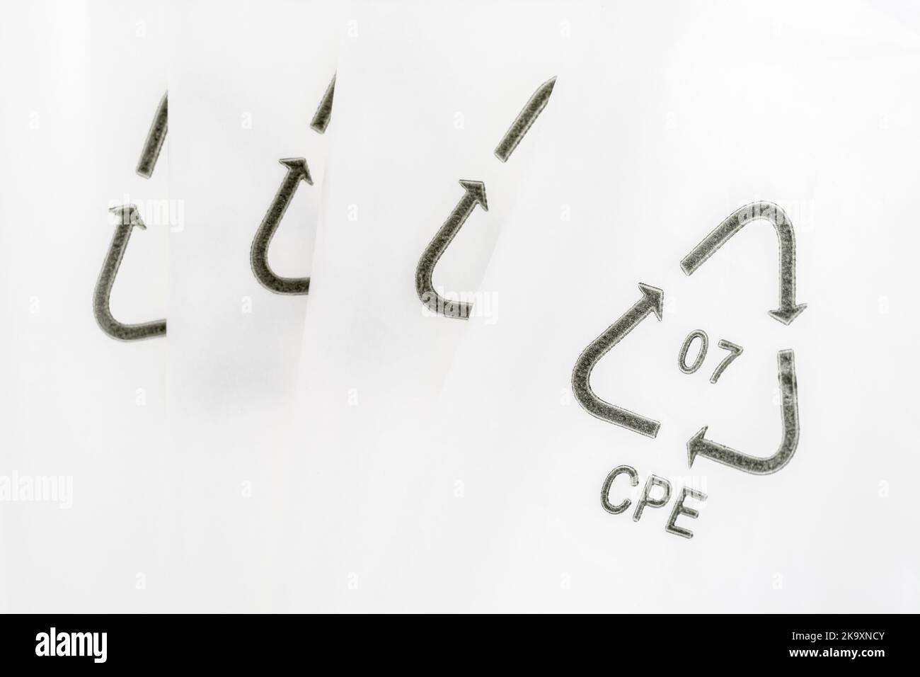 Close-up shot of 07 plastic resin code / Resin Identification Code 7 on plastic packaging. Here ...