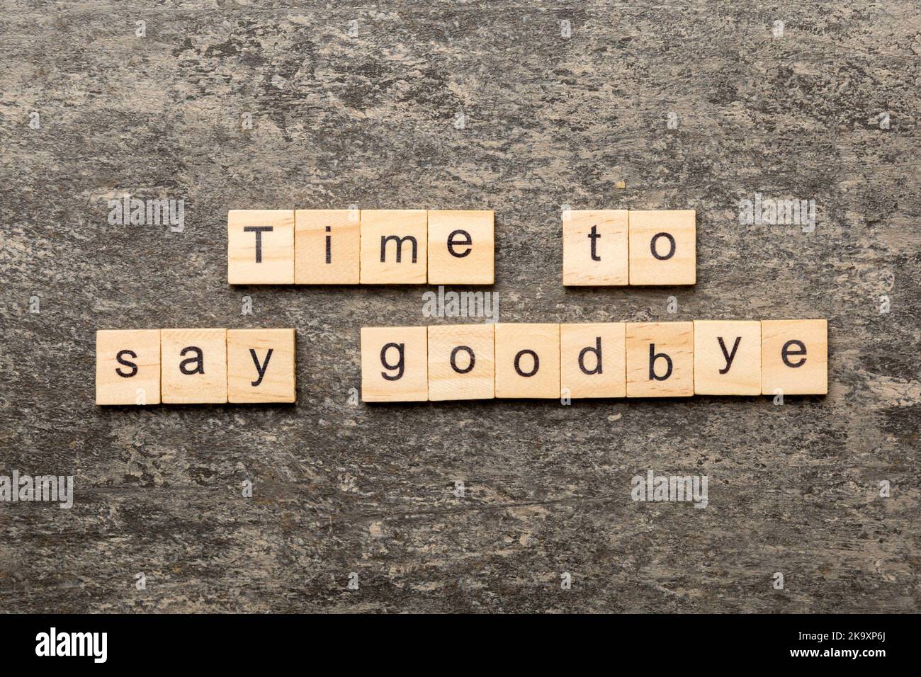 Time to say goodbye word written on wood block. Time to say goodbye ...
