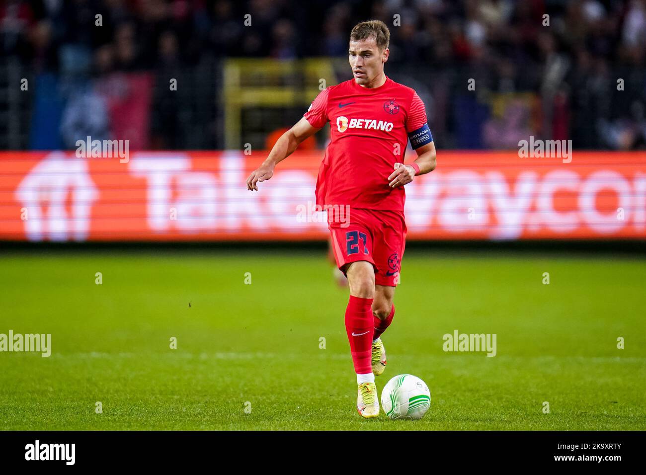 BRUSSELS, BELGIUM - OCTOBER 27: Darius Olaru of FCSB dribbles with the ...