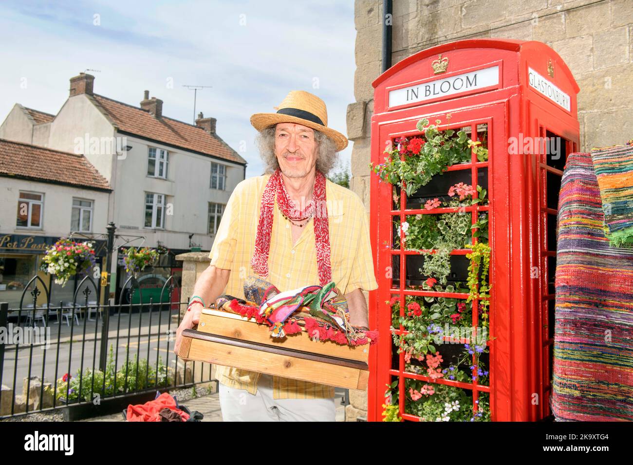 Jewellery and Indian textiles stallholder Dan Crane with a telephone ...