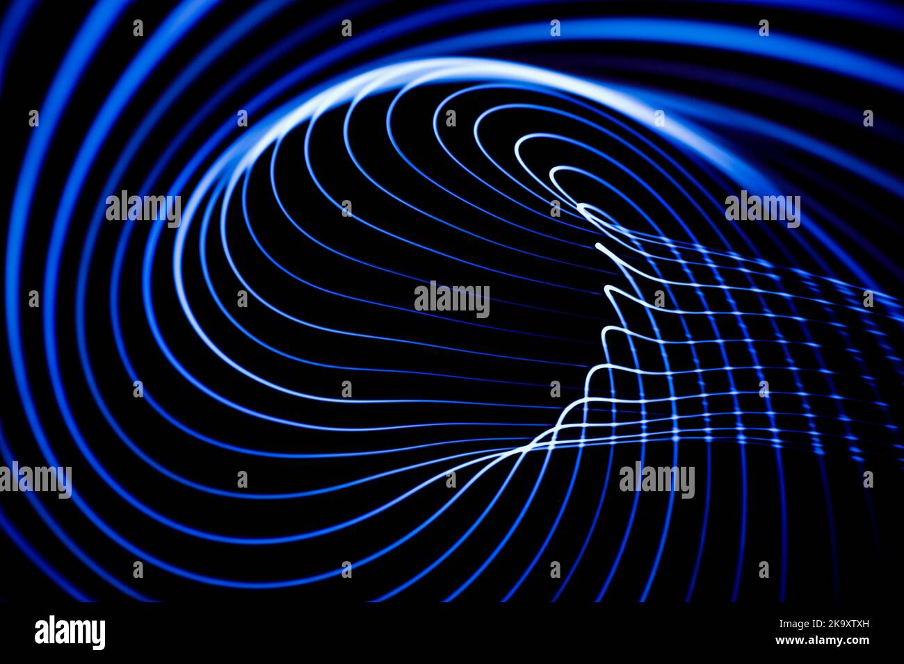 Sound waves in the visible blue color in the dark Stock Photo - Alamy