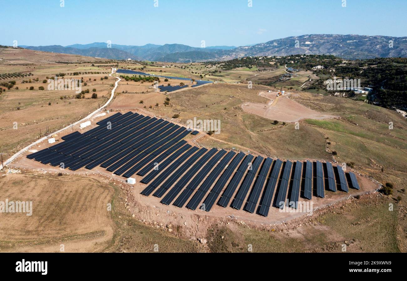 Aerial view of solar panels on a hillside near Thrinia, Paphos district ...