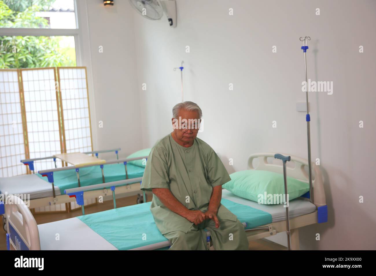 Older sick patient lying in a bed in nursing home Stock Photo - Alamy