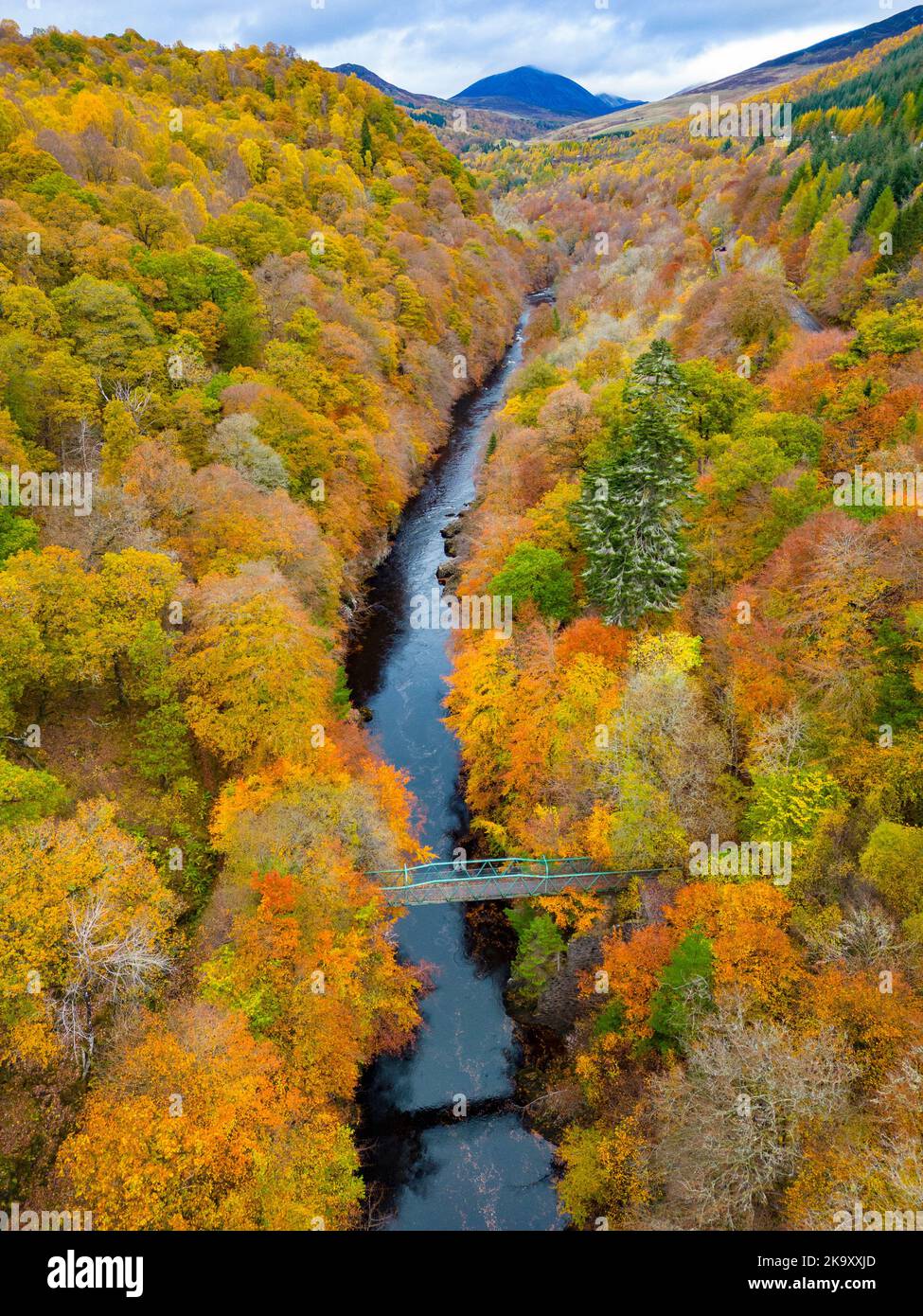 Aerial view of spectacular late autumn colours in trees beside the ...