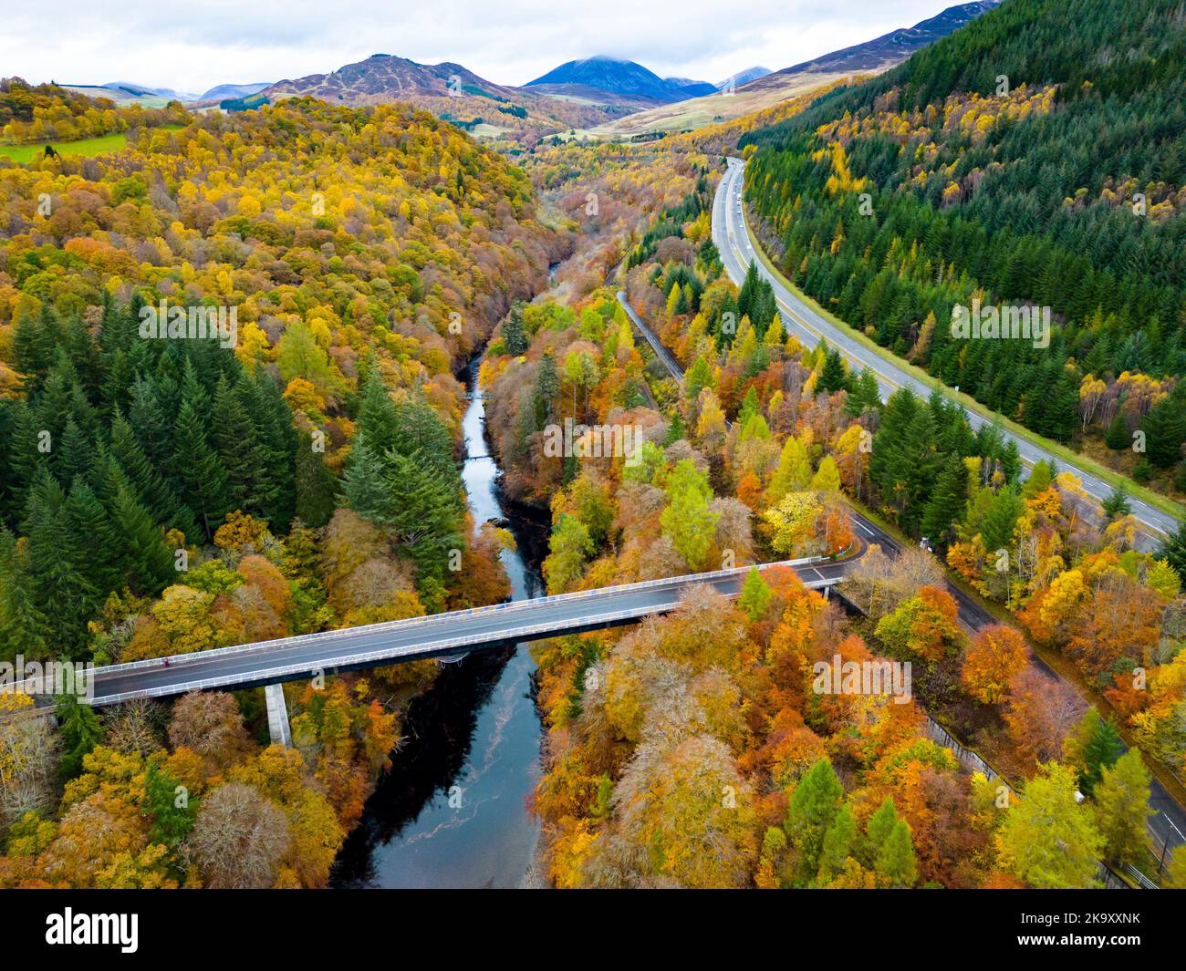 Aerial view of spectacular late autumn colours in trees beside the ...
