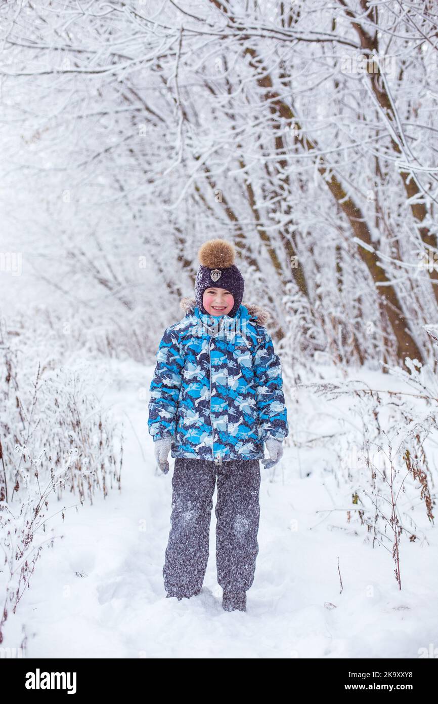 boy throwing snow in the air at sunny winter day, back view Stock Photo ...