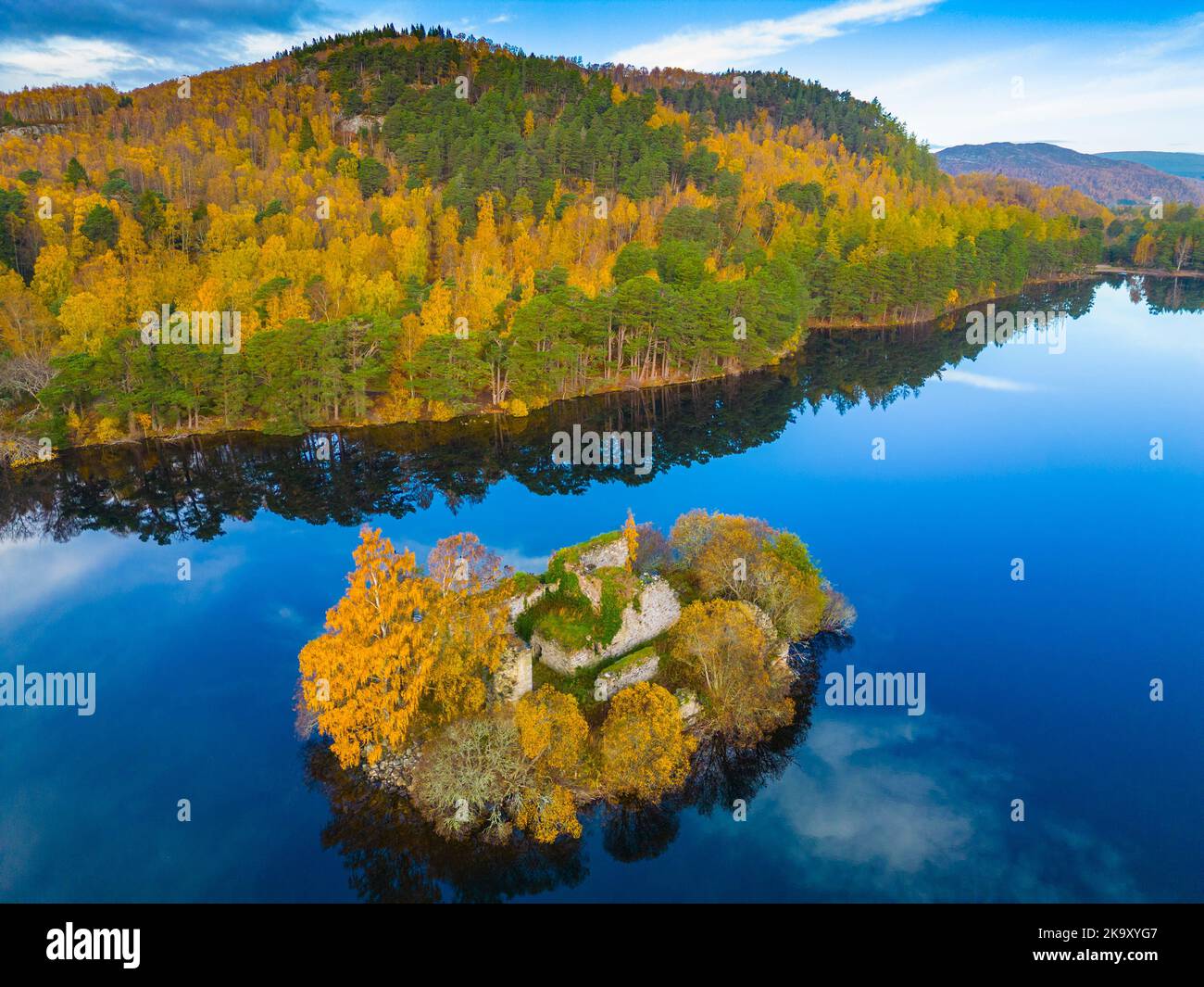 Aerial view of autumn colours at ruined castle on island on Loch an ...