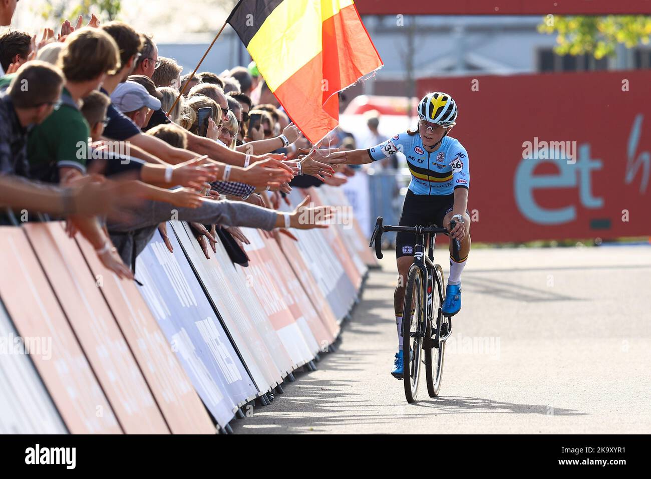 Belgian Fleur Moors crosses the finish line at the woman's junior race ...