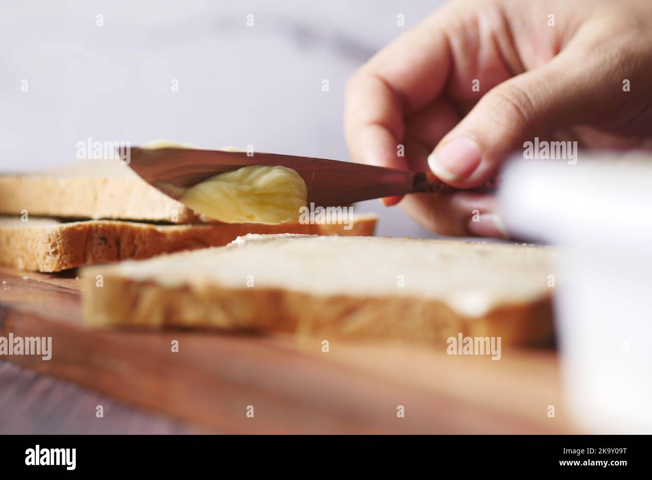 fresh butter spreading on a bread Stock Photo - Alamy