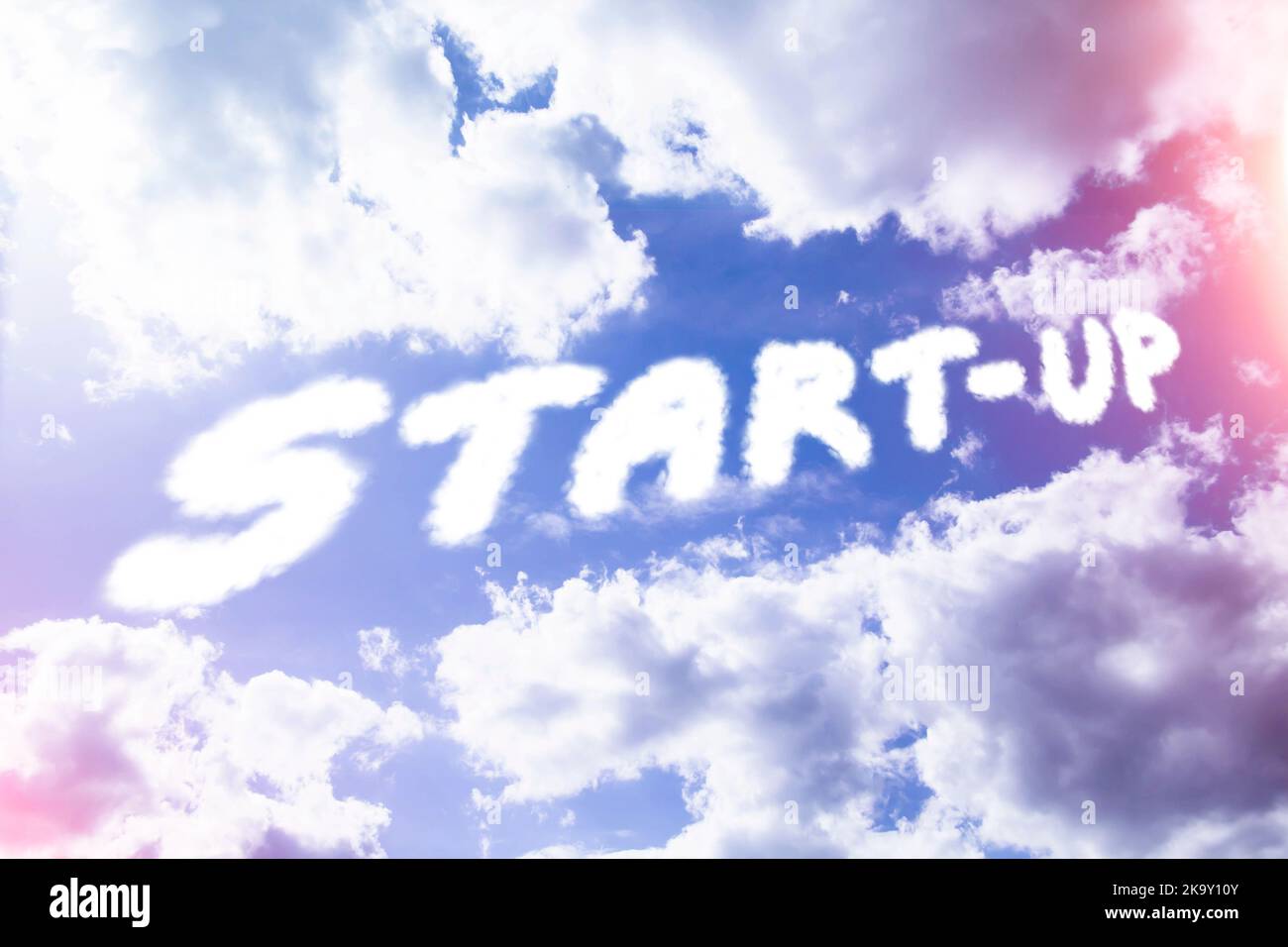 Start up. Text from clouds in sky in bright sunlight Stock Photo - Alamy